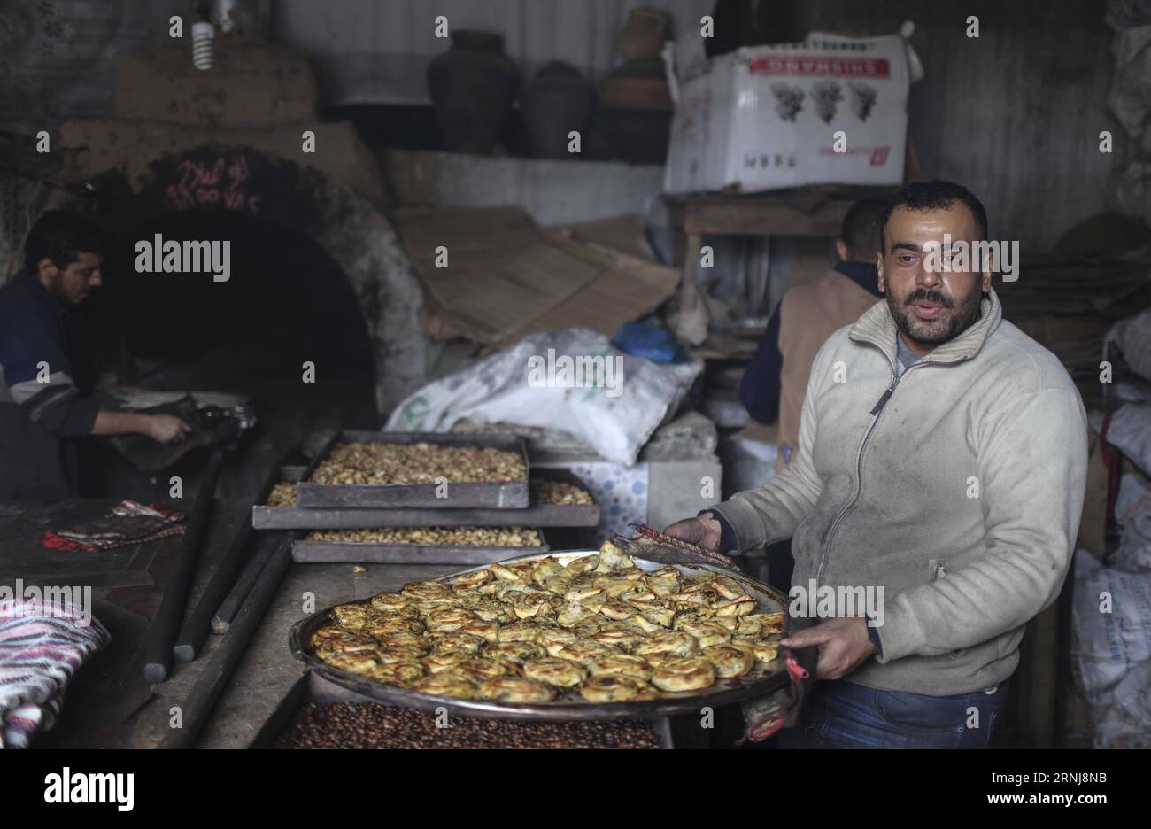 GAZA, Jan. 3, 2017 -- A baker shows bread made with a traditional wood ...