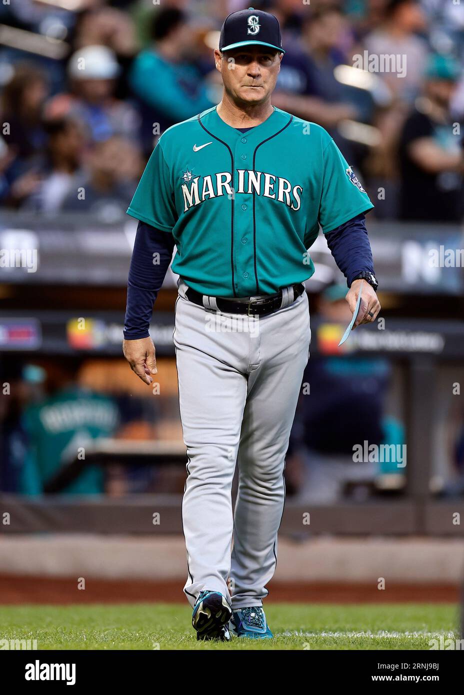 Seattle Mariners manager Scott Servais (9) walks on the field against ...