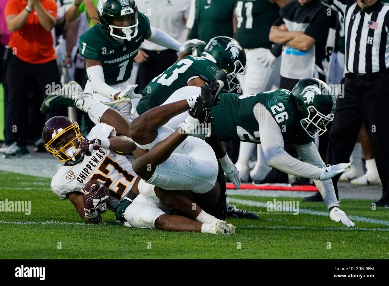 Central Michigan running back Sam Hicks (27) is tackled during the ...