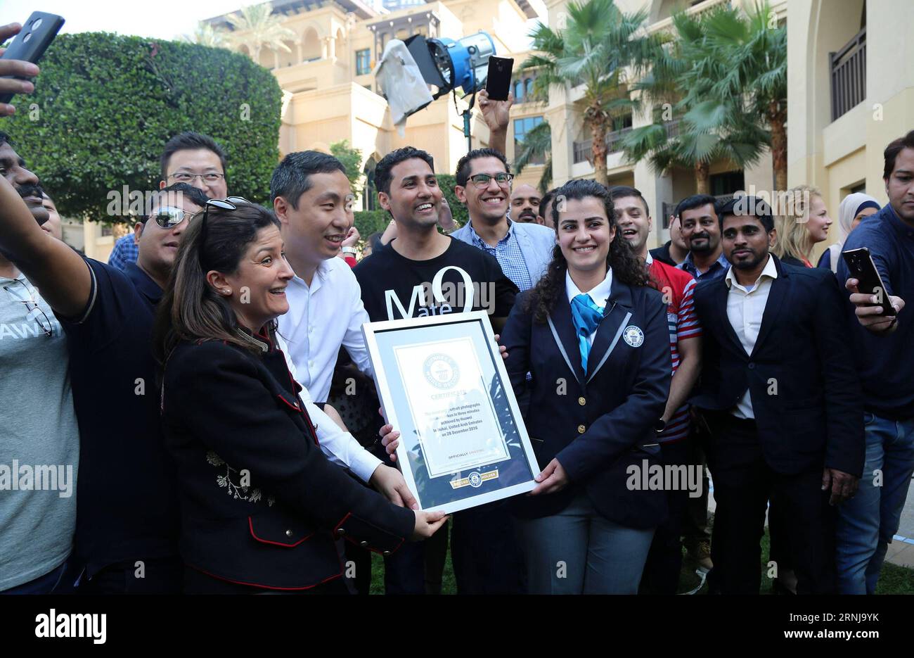 Representatives of Chinese ICT giant Huawei receive a certificate of ...