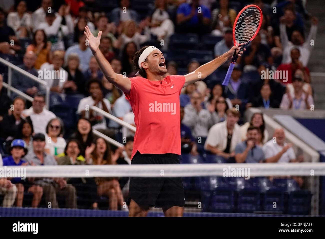 Taylor Fritz, of the United States, reacts after winning a point ... Taylor Fritz, of the United States, reacts after winning a point ...