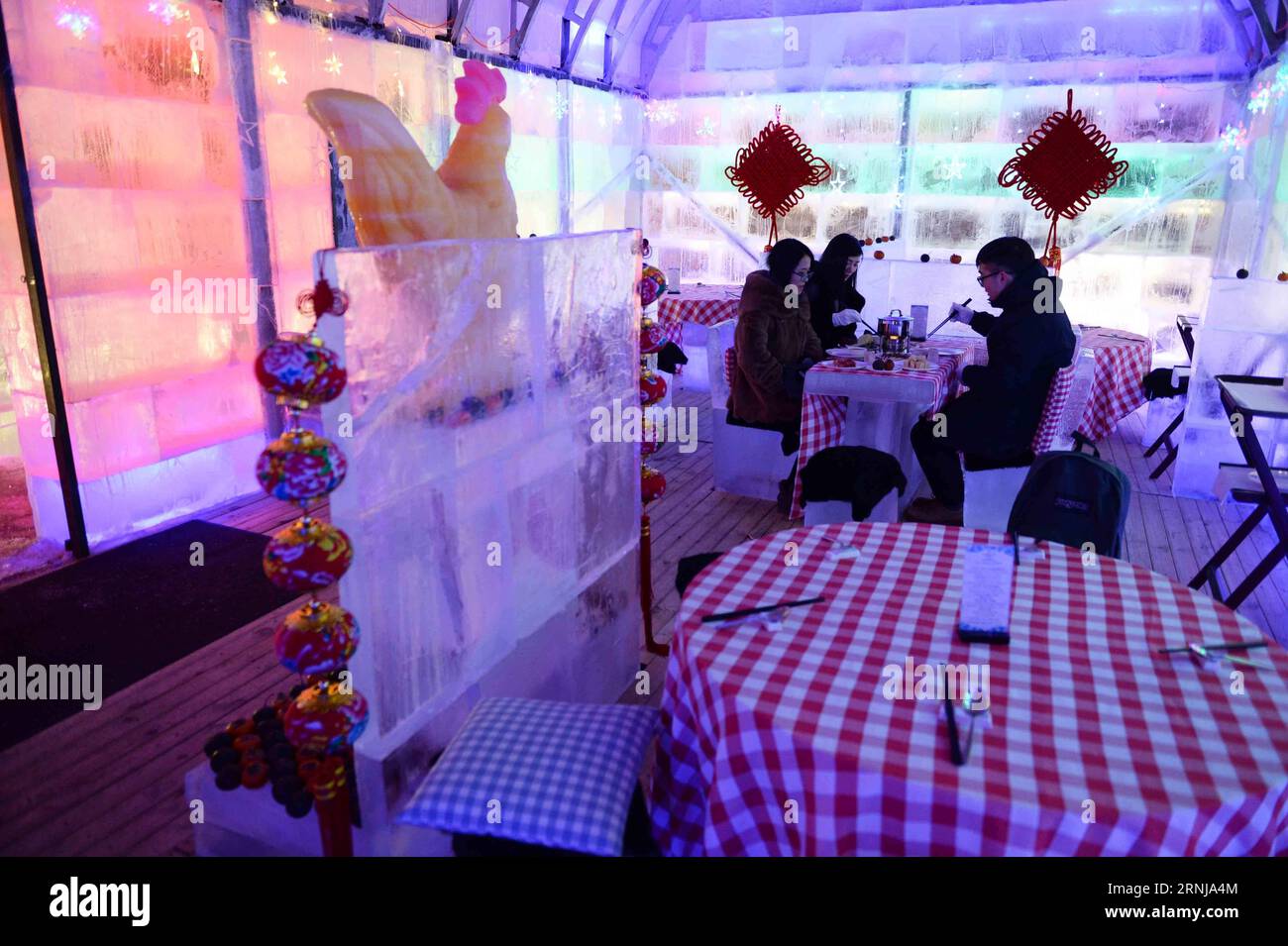 People enjoy a meal in an ice restaurant in Harbin, northeast China s ...