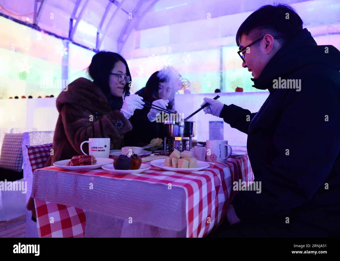 People enjoy a meal in an ice restaurant in Harbin, northeast China s ...
