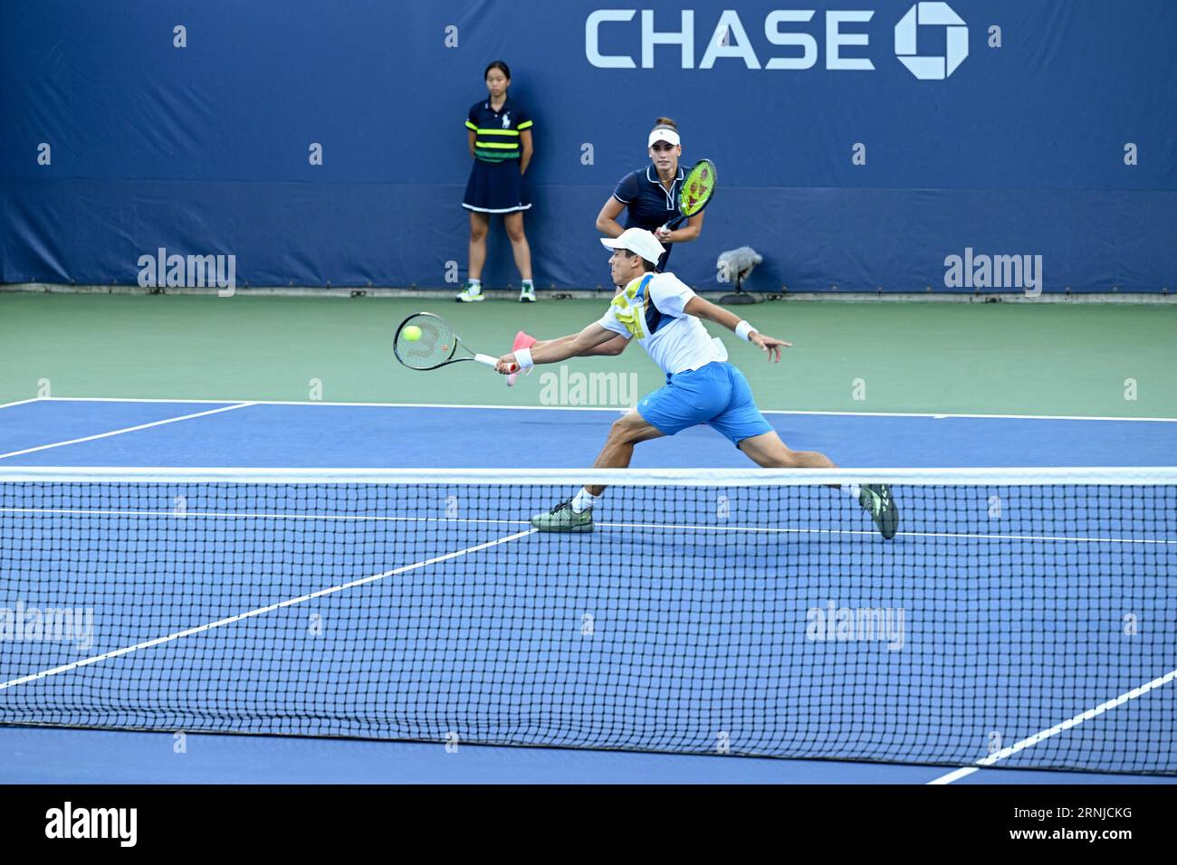 Maria Mateas and Mackenzie McDonald in action during a mixed doubles ...