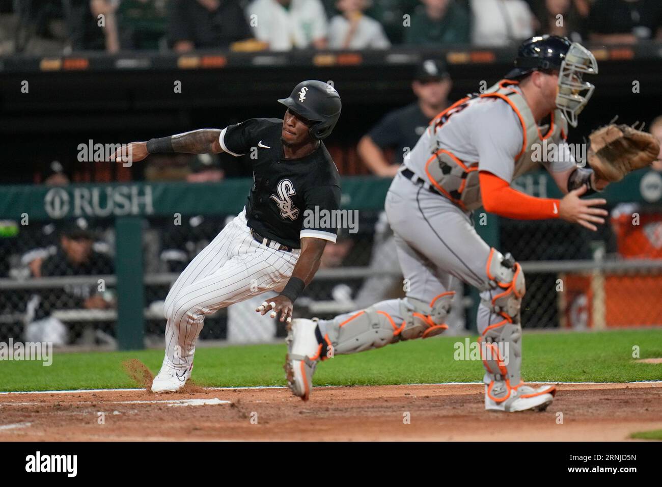 Chicago White Sox's Tim Anderson, left, slides by Detroit Tigers ...
