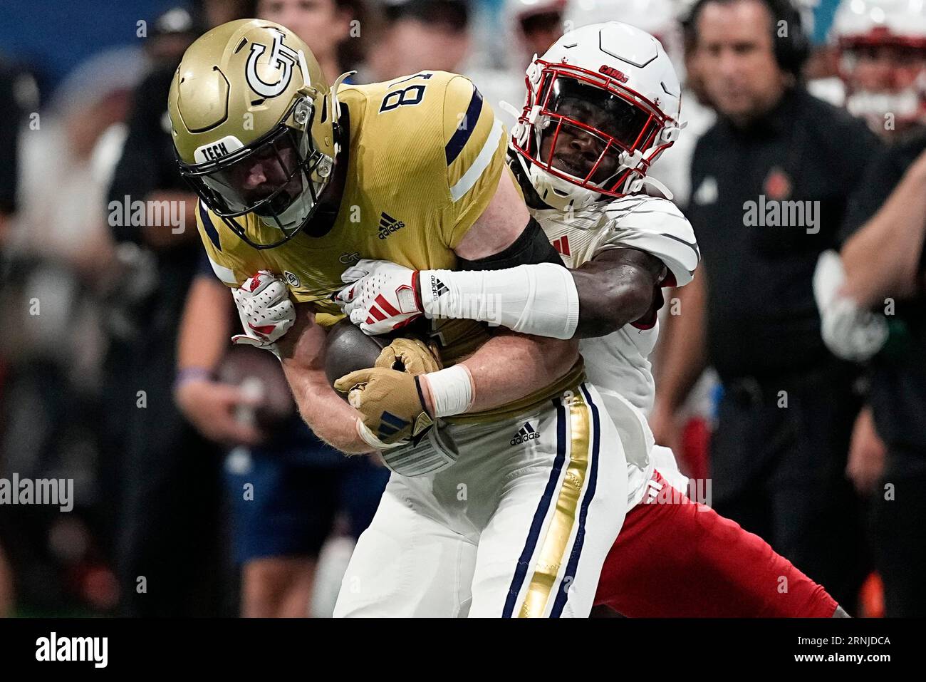 Louisville defensive back Jarvis Brownlee Jr. (2) tackles Georgia Tech ...
