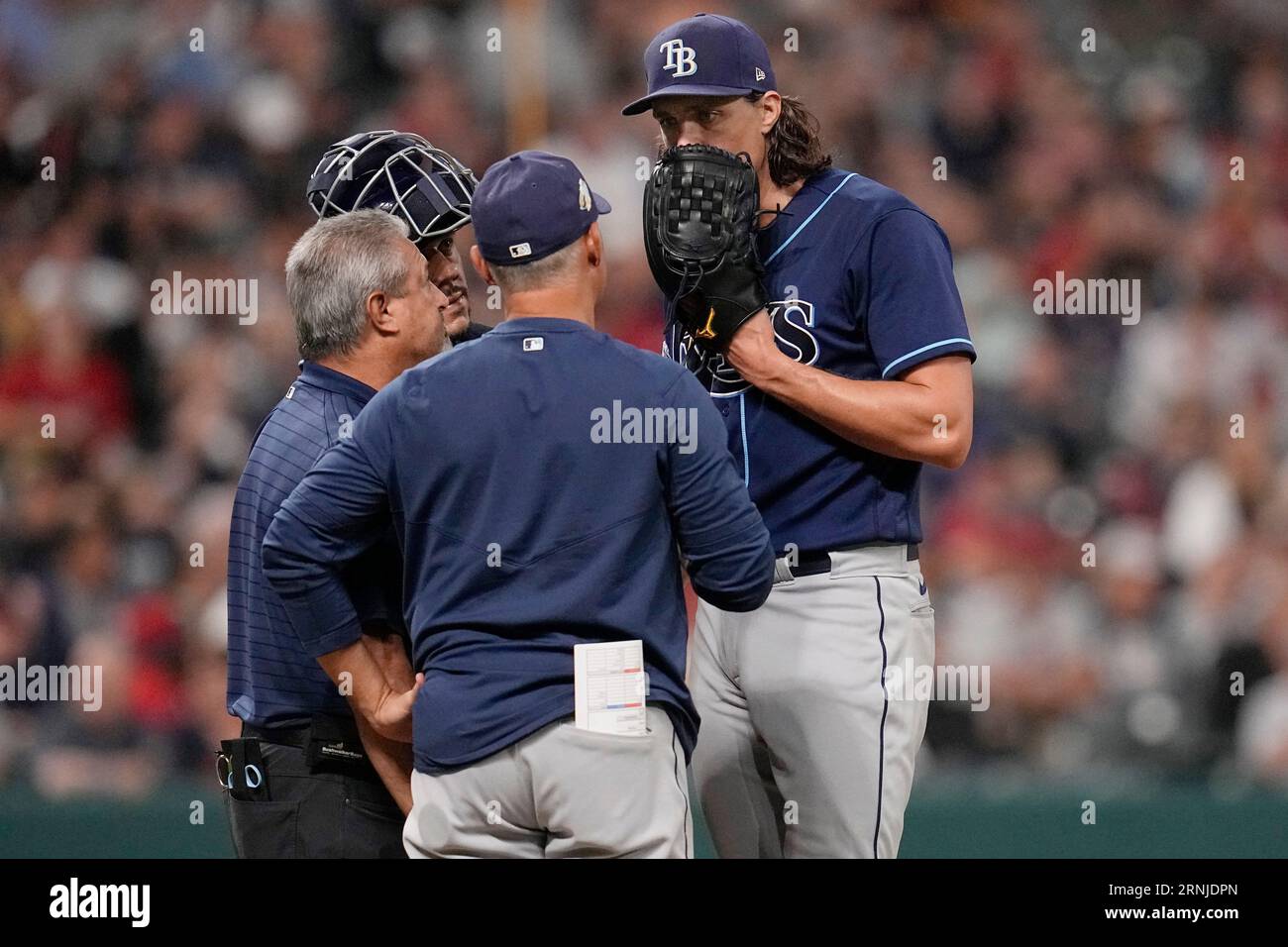 Tampa Bay Rays starting pitcher Tyler Glasnow, right, is visited on the ...