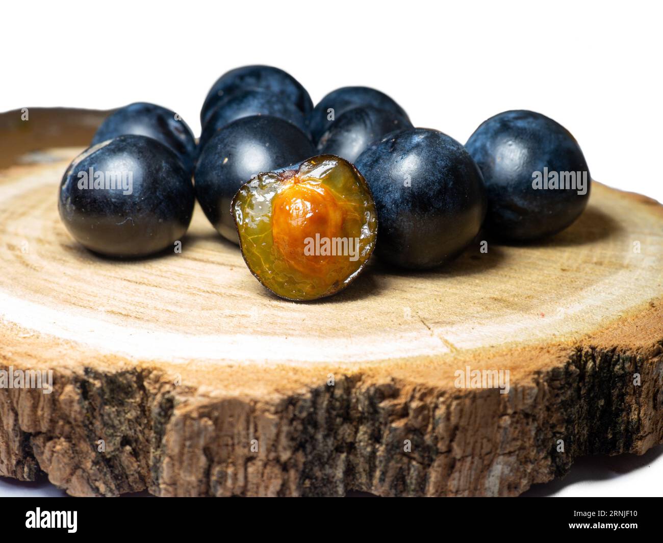 fruit of Blackthorn. Type of plum genus. early fruit on a white ...