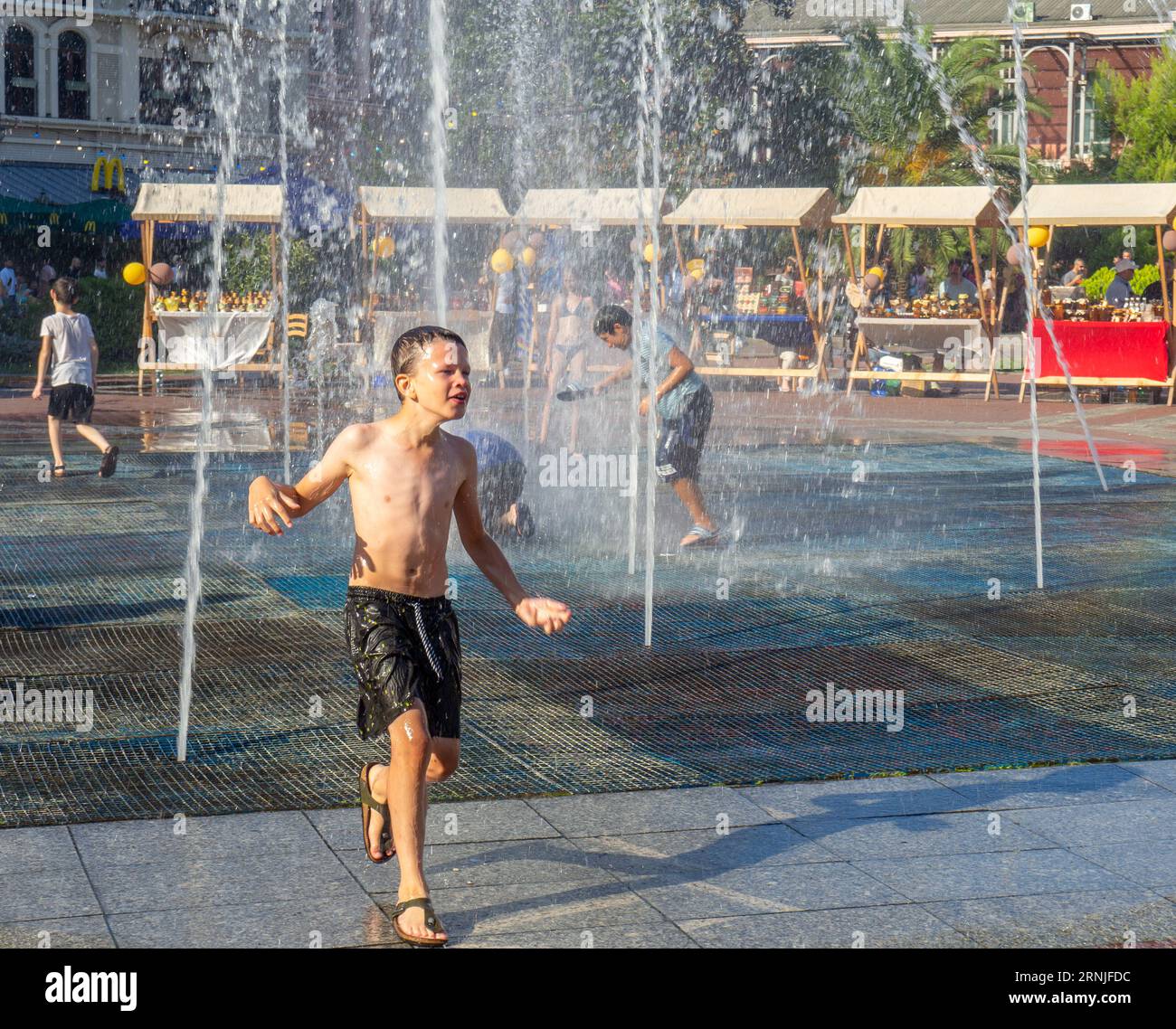 Batumi, Georgia. 08.19.2023 Children play in the fountain. Children's ...