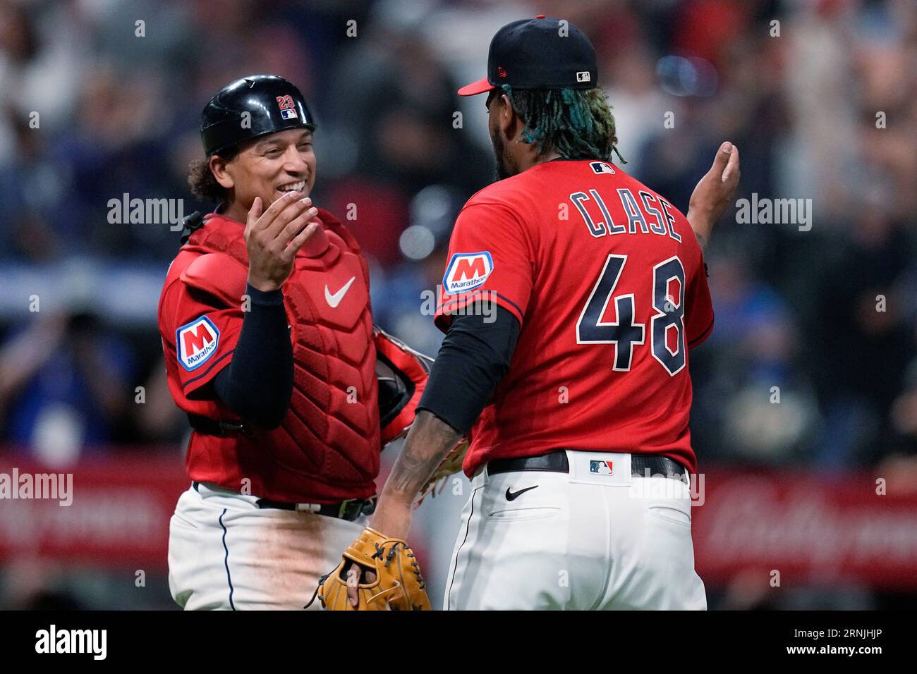 Cleveland Guardians catcher Bo Naylor, left, and pitcher Emmanuel Clase ...