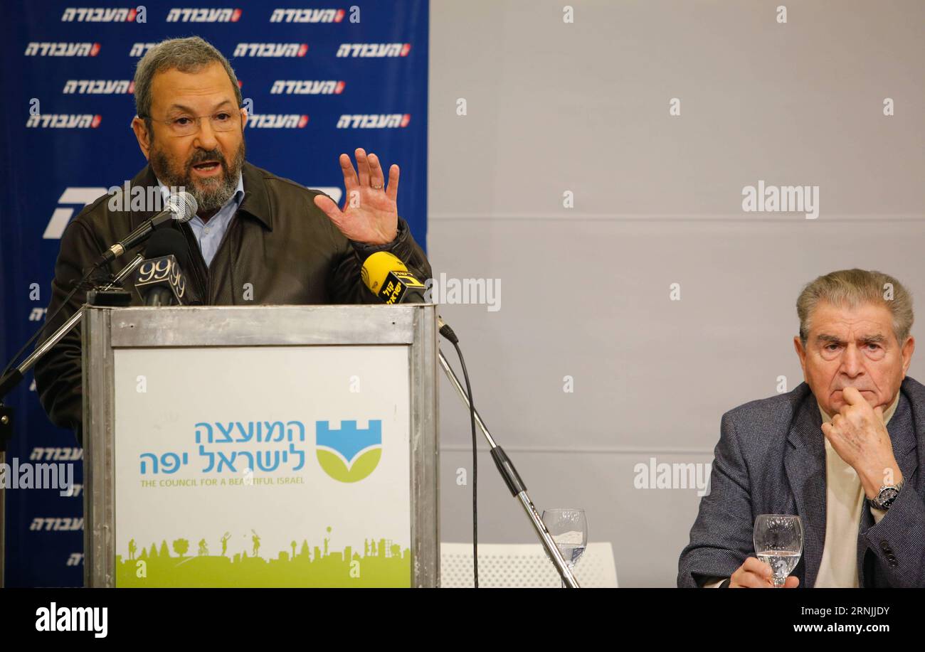 Former Israeli Prime Minister Ehud Barak (L) speaks during a Labor ...