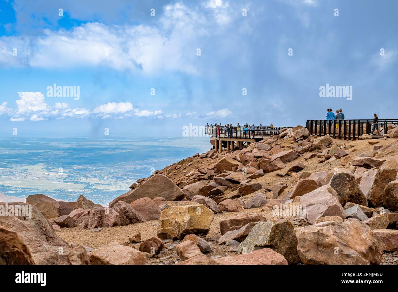 Pikes Peak Colorado Springs - tourists at summit take in view of clouds ...