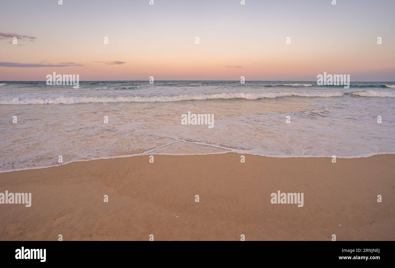 The surf and colorful sky at dusk along Kawana beach on the Sunshine ...