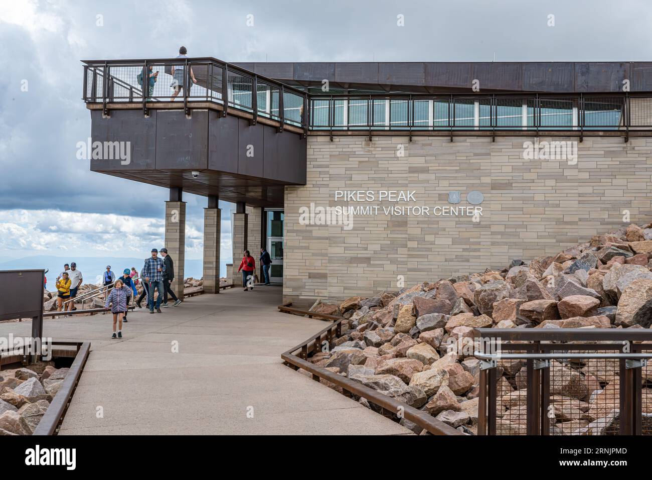 Pikes Peak Colorado Springs - tourists at summit take in view of clouds ...