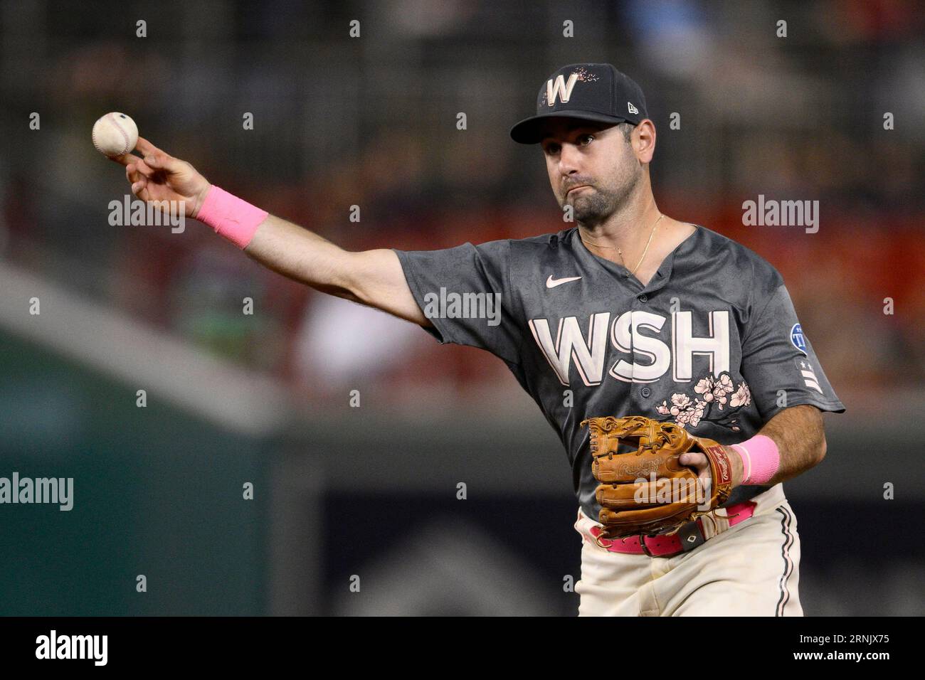 Washington Nationals second baseman Jake Alu throws to first to put out ...