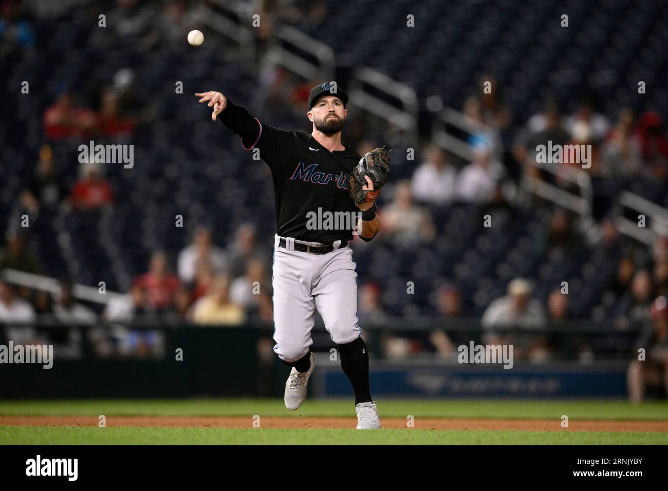Miami Marlins third baseman Jon Berti throws to first for the out on ...