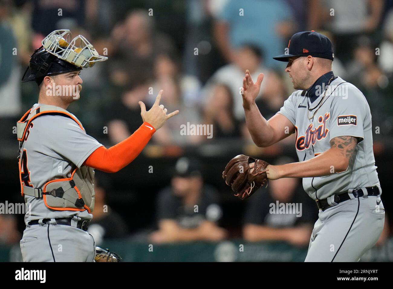 Detroit Tigers catcher Jake Rogers, left, and relief pitcher Alex Lange ...