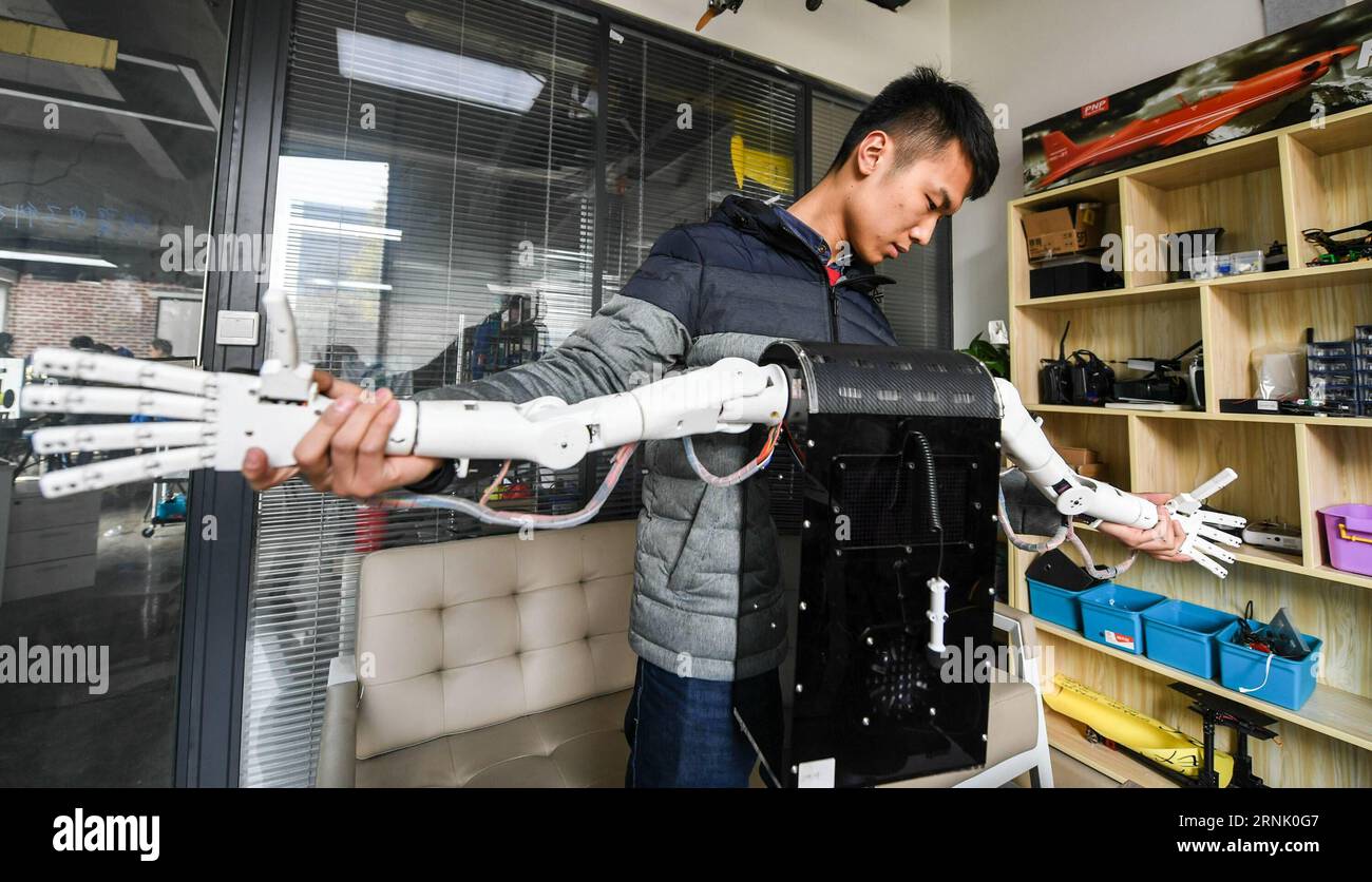 (170224) -- ZHENGZHOU, Feb. 24, 2017 -- Song Jiyuan checks a robot ...