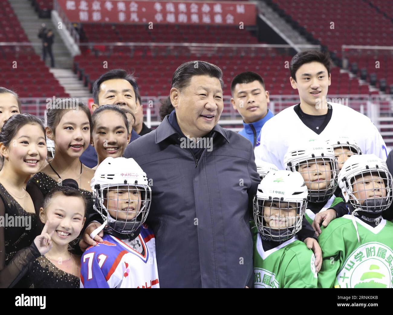 Chinese President Xi Jinping poses for a group photo with ice hockey ...