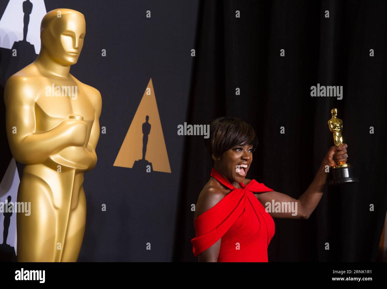 Actress Viola Davis poses after winning the Best Supporting Actress for her performance in ...