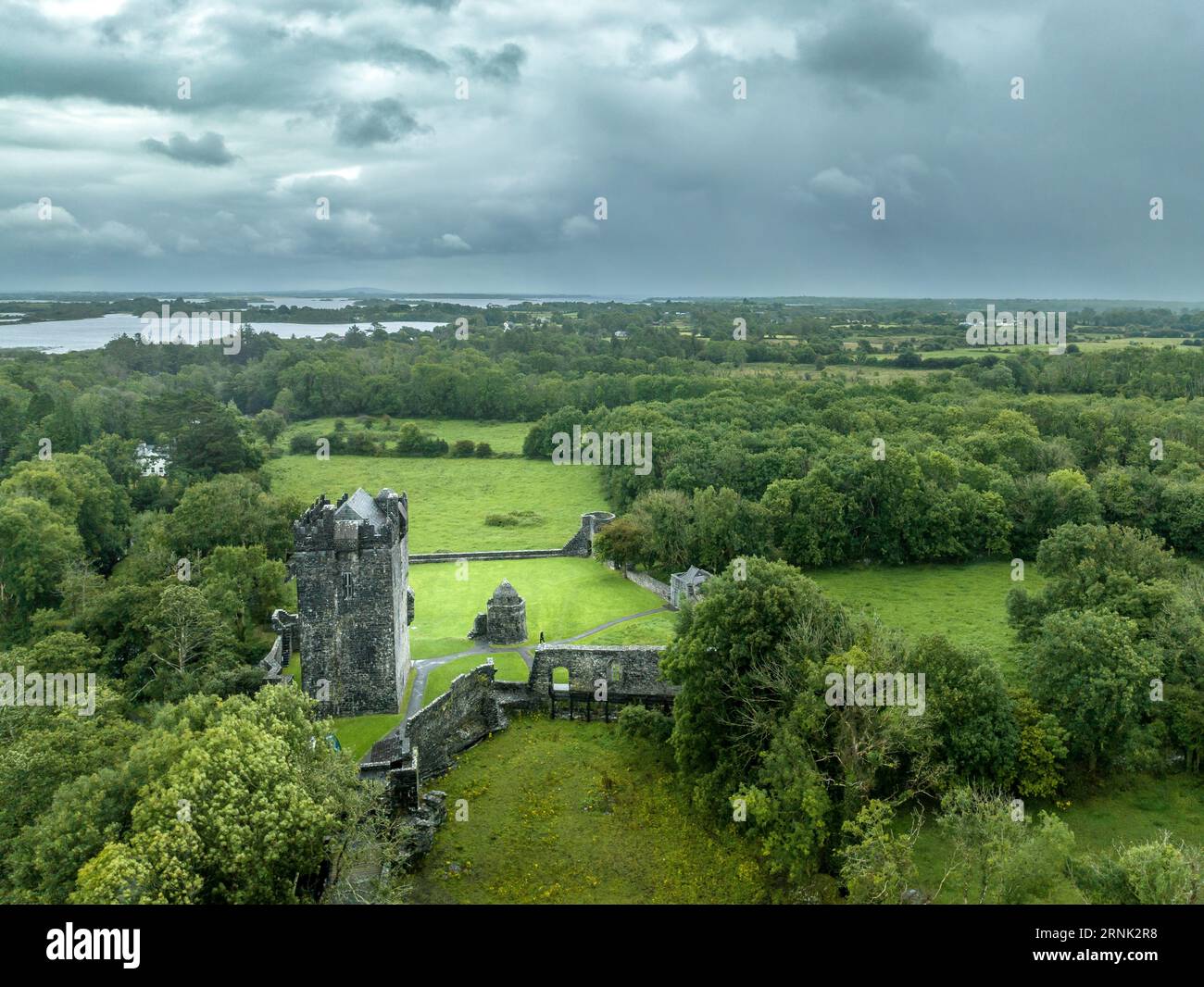 Aerial view of Aughnanure castle in Ireland with large multi ...
