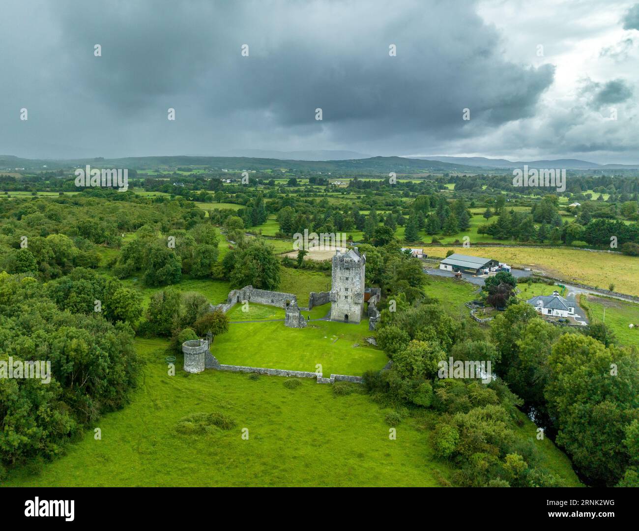 Aerial view of Aughnanure castle in Ireland with large multi ...