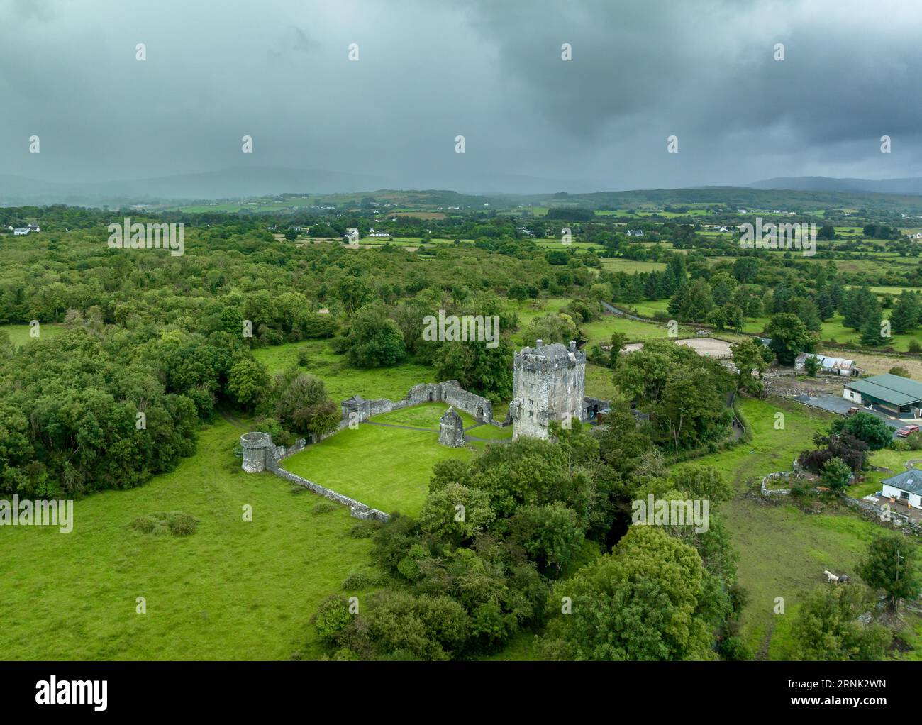 Aerial view of Aughnanure castle in Ireland with large multi ...