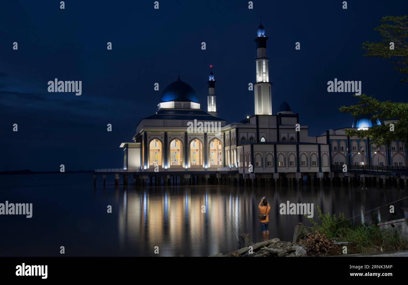 Outdoor scene of the famous architectural floating Tuminah Mosque ...