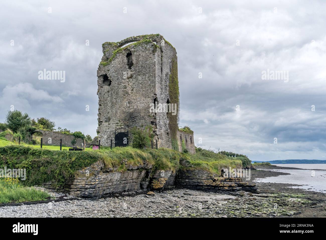 Beagh castle abandoned military tower on the Irish coast with cloudy ...