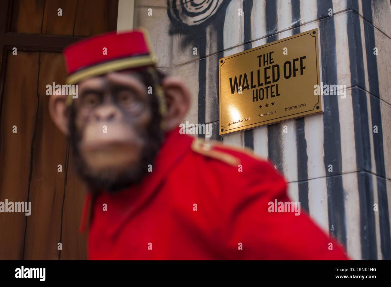 A monkey bellboy installation is seen outside The Walled Off Hotel in ...