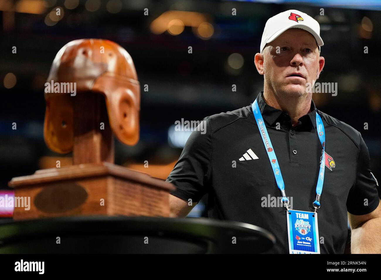 Louisville head coach Jeff Brohm stands on a stage near the Old Leather ...