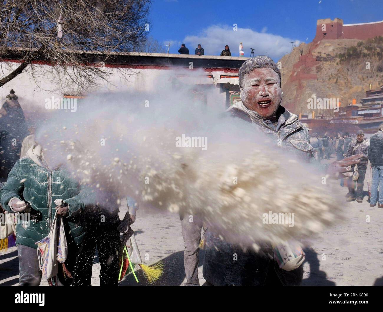 (170312) -- LHASA, March 12, 2017 -- People bless each other by casting ...