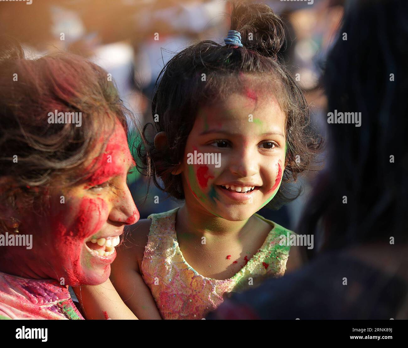 (170312) -- PASAY CITY, March 12, 2017 -- A mother carries her daughter ...