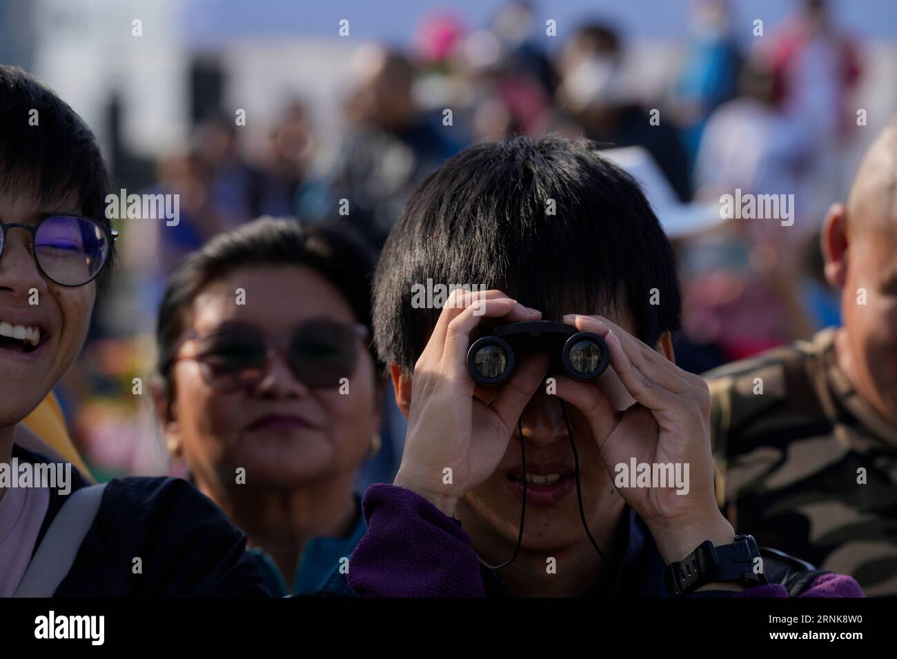 People look at Mongolian President Ukhnaagiin Khurelsukh, right, and ...