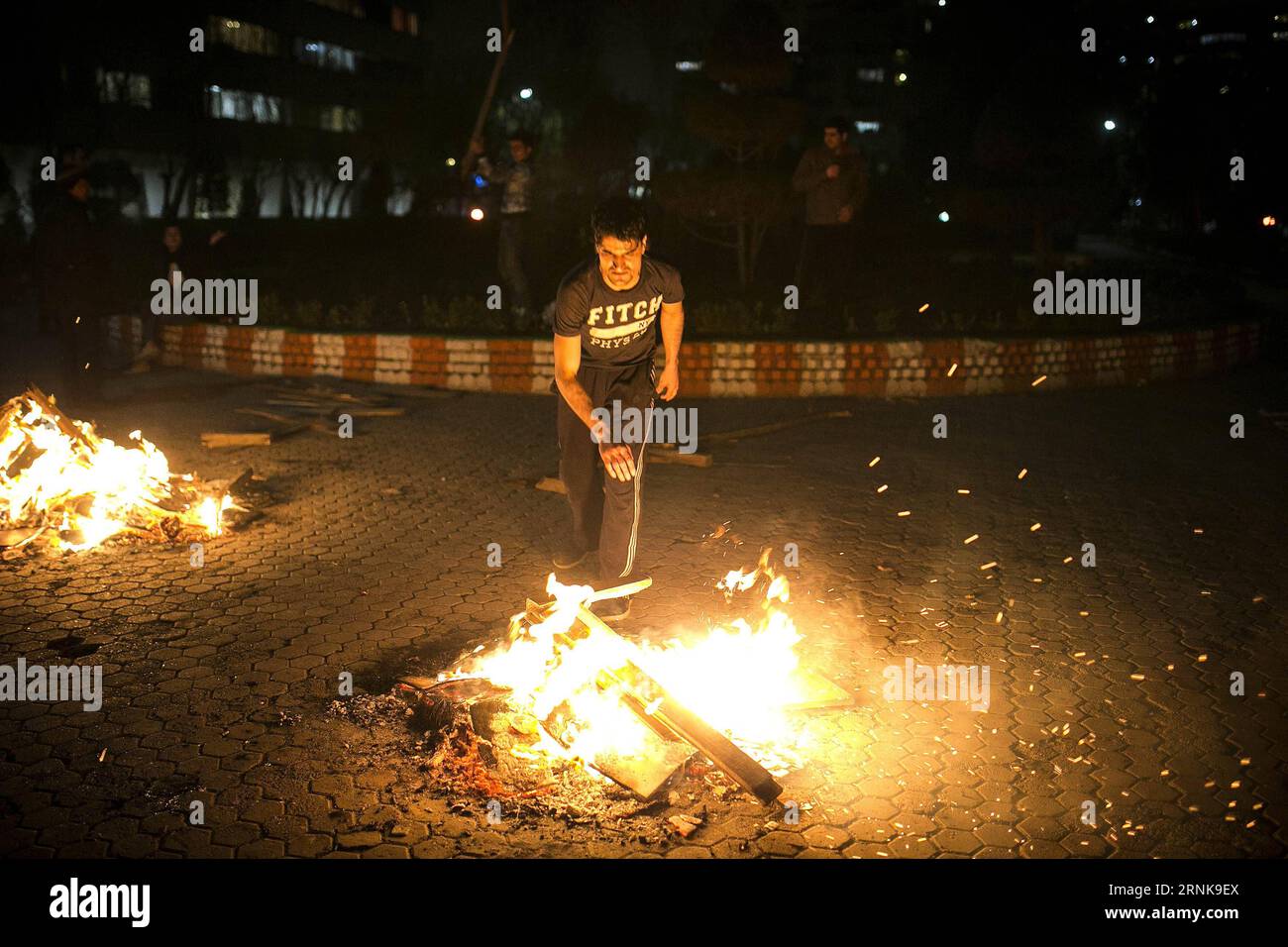 (170315) -- TEHRAN, March 15, 2017 -- A man sets a bonfire in Tehran ...