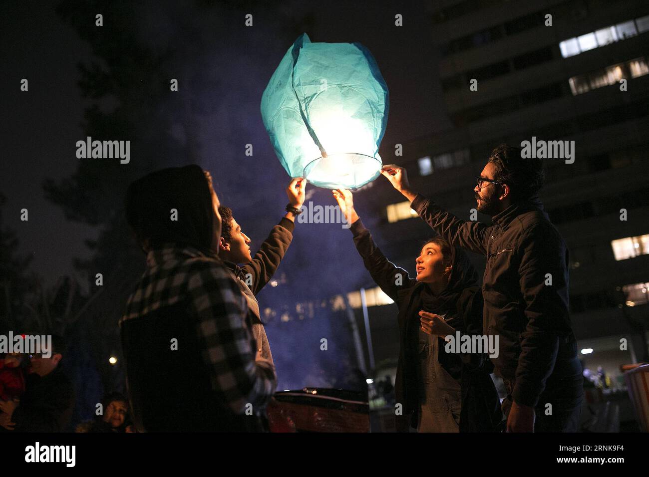 (170315) -- TEHRAN, March 15, 2017 -- An Iranian family sets a fire ...