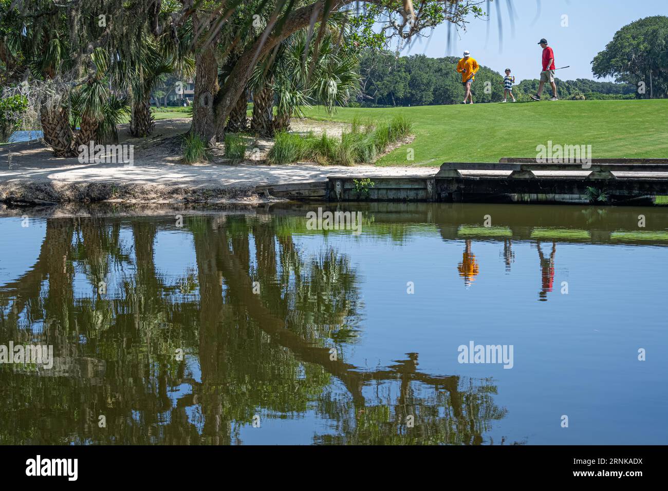 Golfers (and a future golfer) enjoying the Little Sandy Short Course at ...