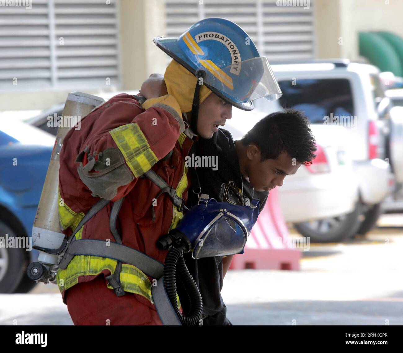 (170331) -- QUEZON CITY, March 31, 2017 -- A firefighter saves a mock ...