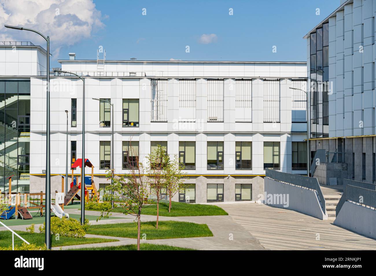 New building facade in housing complex. Modern style in architecture ...