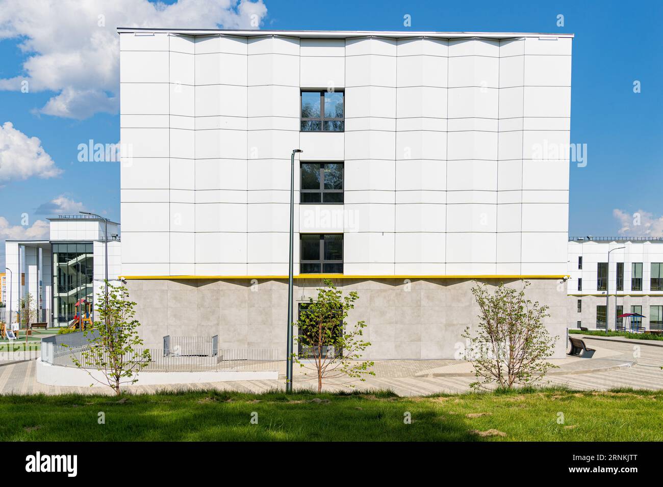 New building facade in housing complex. Modern style in architecture ...