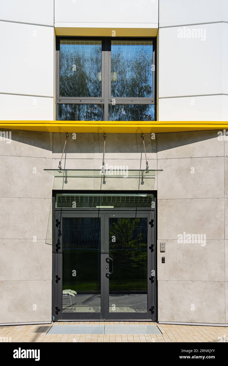 New building facade in housing complex. Modern style in architecture ...