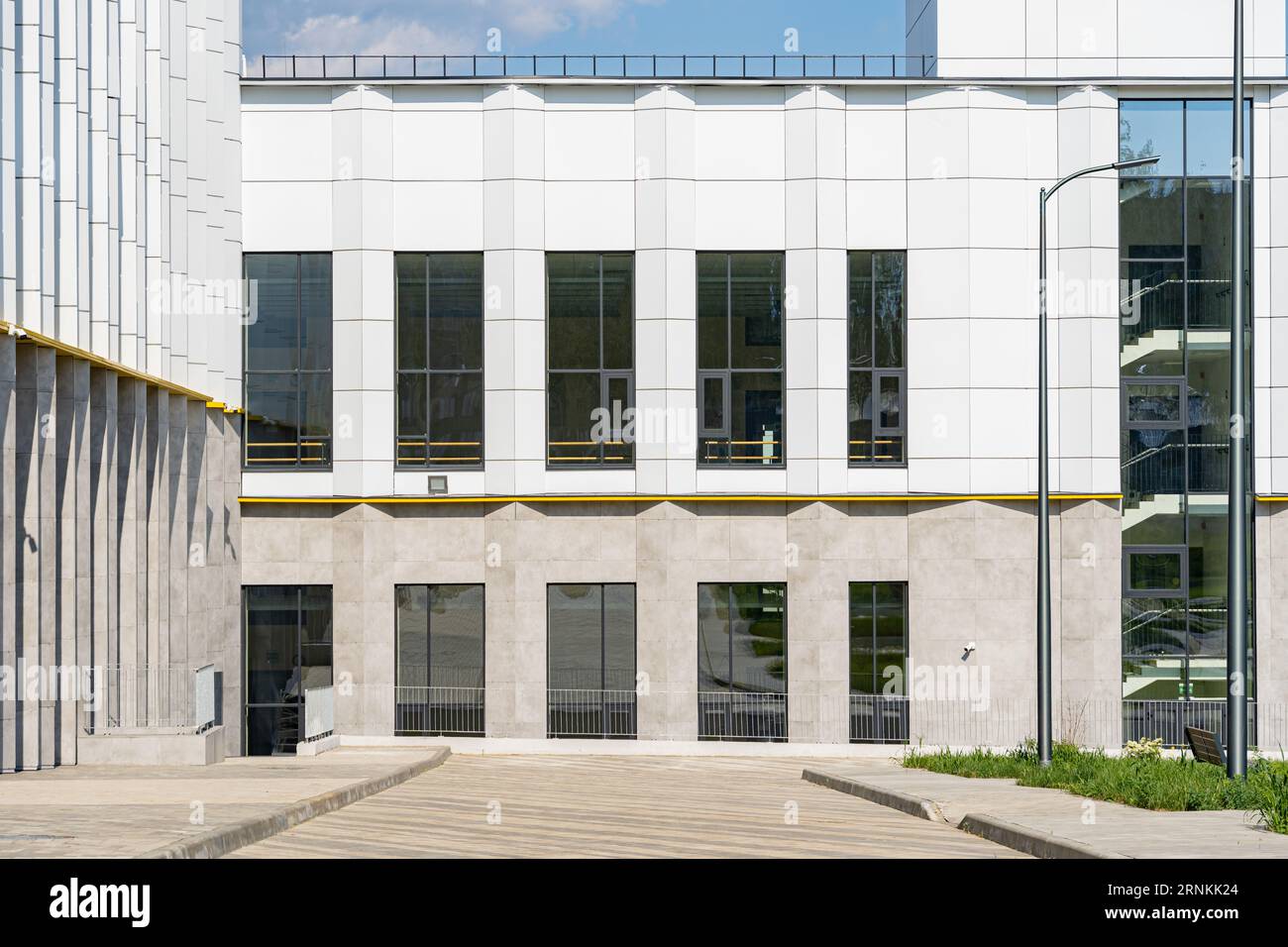 New building facade in housing complex. Modern style in architecture ...