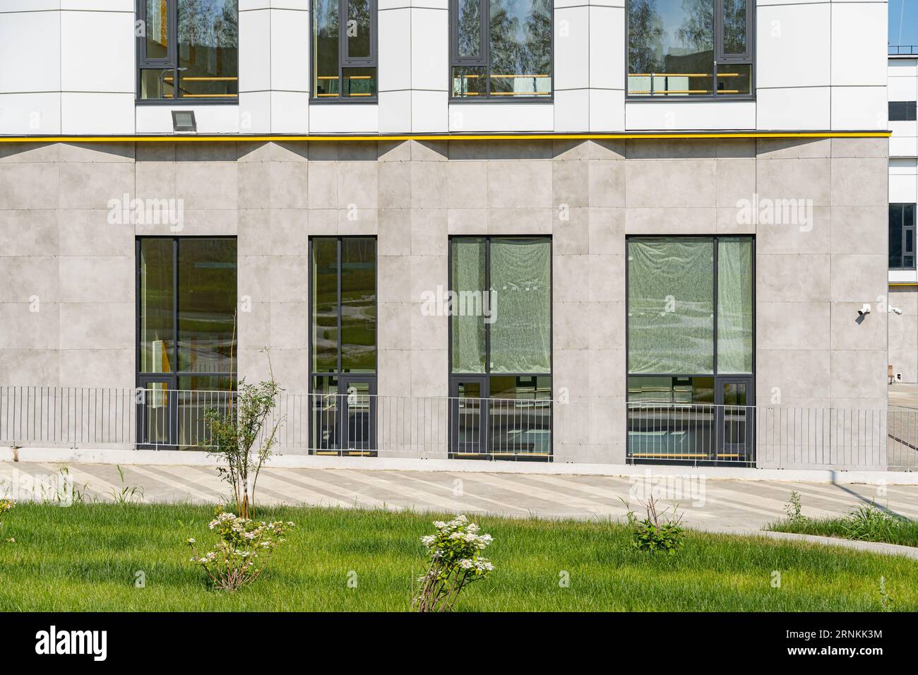 New building facade in housing complex. Modern style in architecture ...