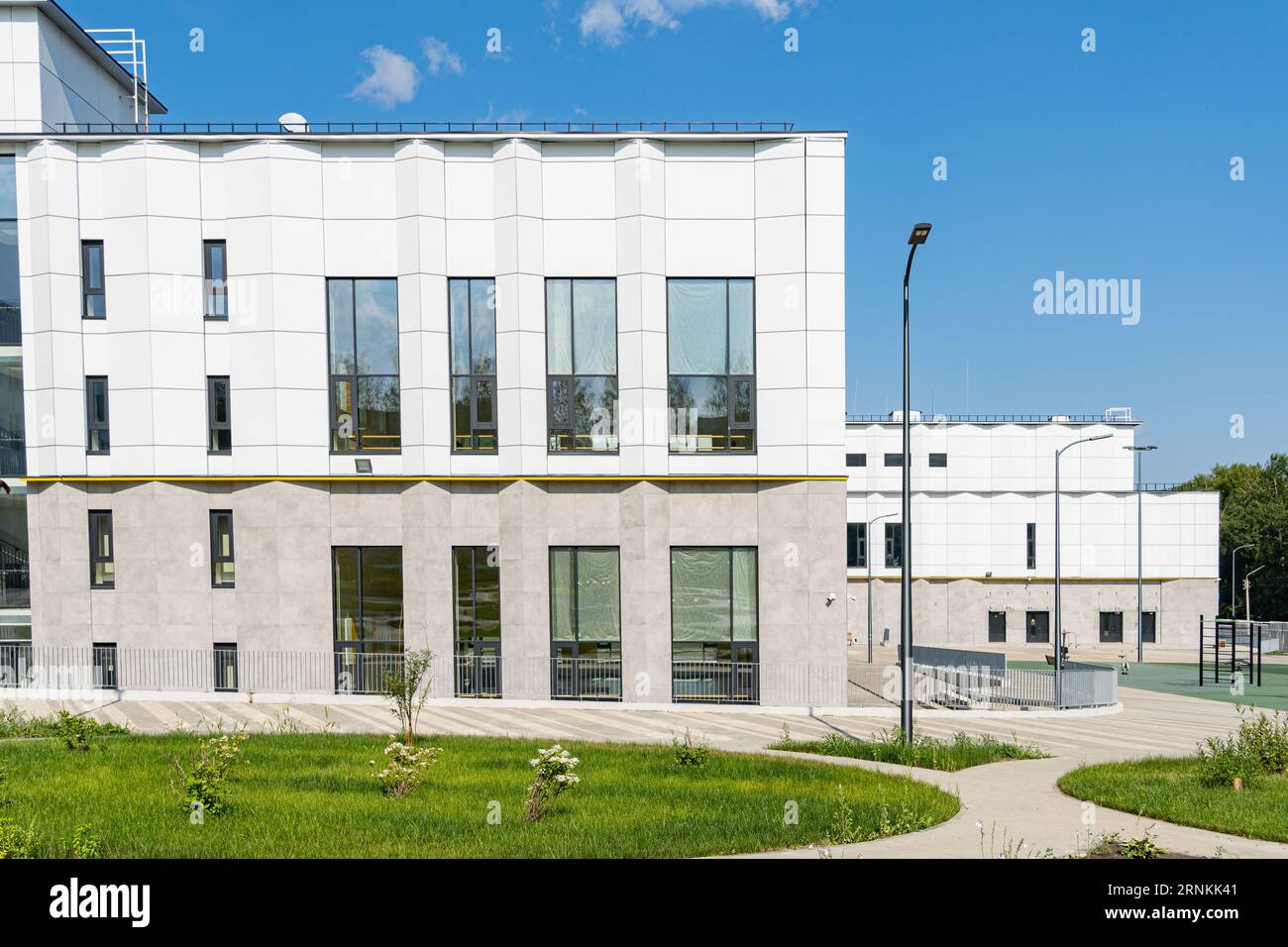 New building facade in housing complex. Modern style in architecture ...