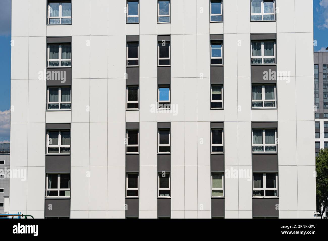 New building facade in housing complex. Modern style in architecture ...