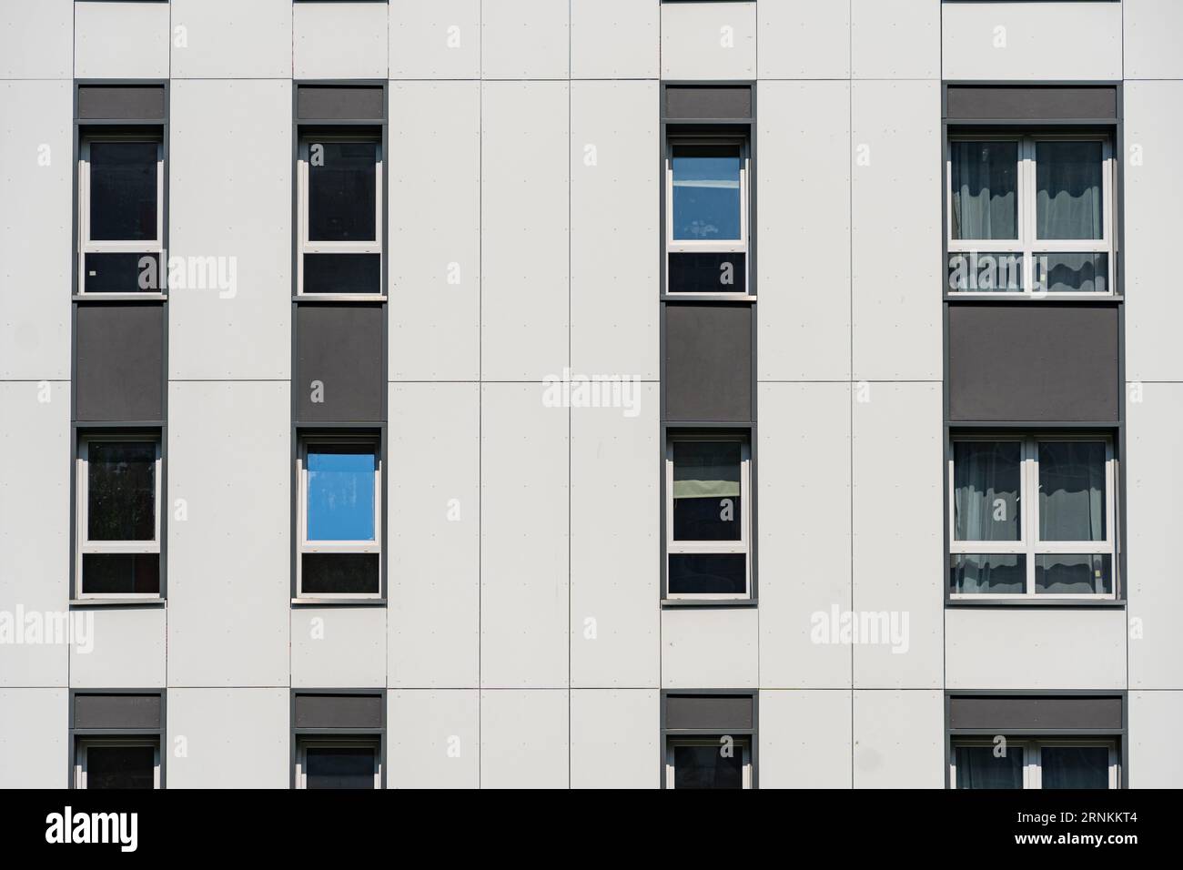 New building facade in housing complex. Modern style in architecture ...