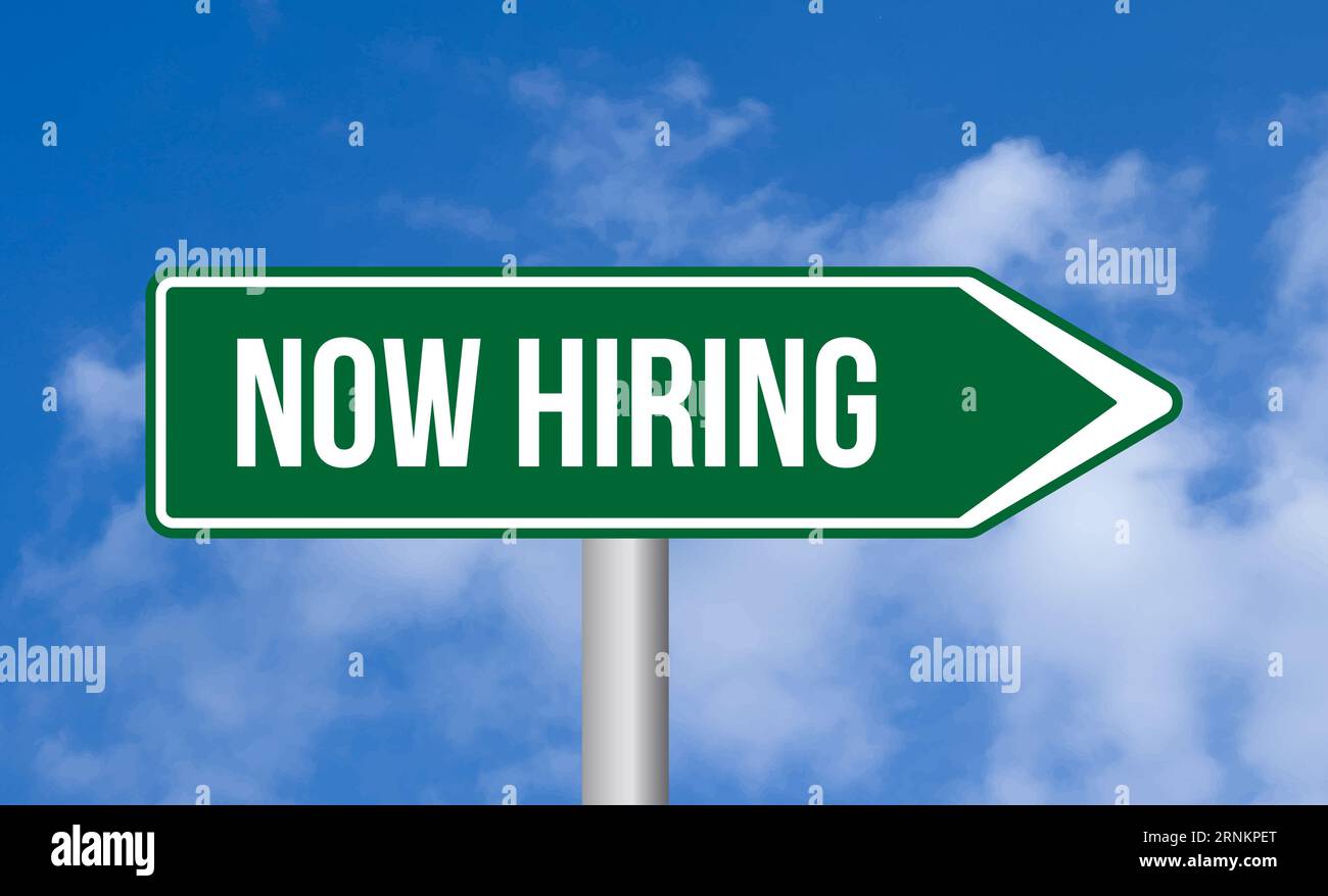Now hiring road sign on blue sky background Stock Photo - Alamy