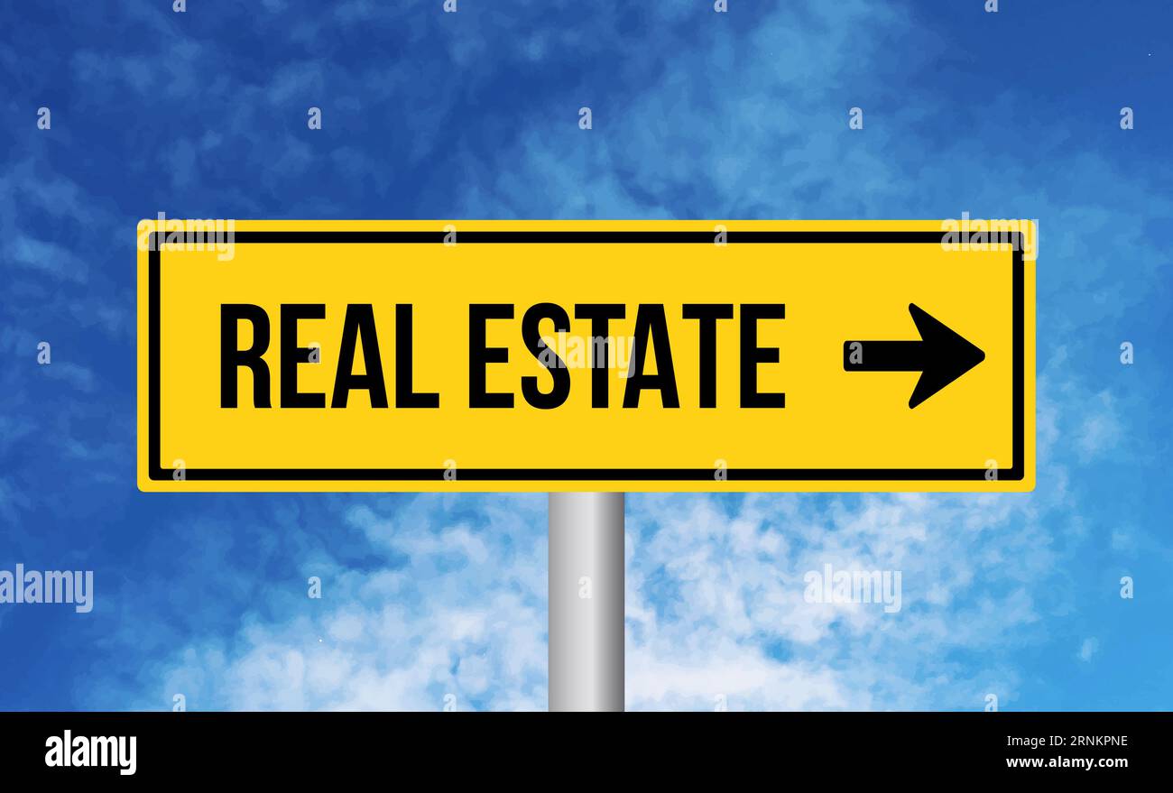 Real estate road sign on blue sky background Stock Photo - Alamy