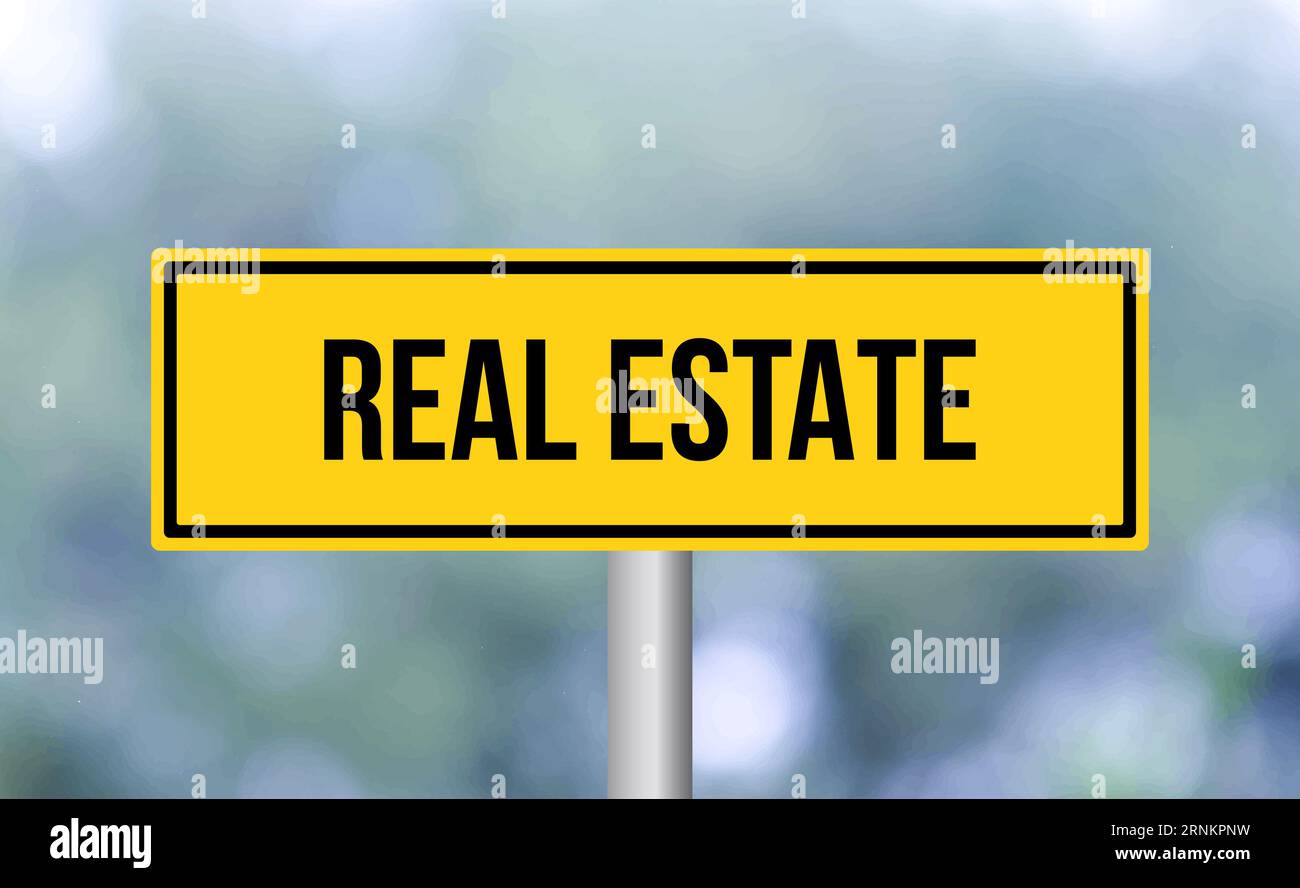 Real estate road sign on blur background Stock Photo - Alamy