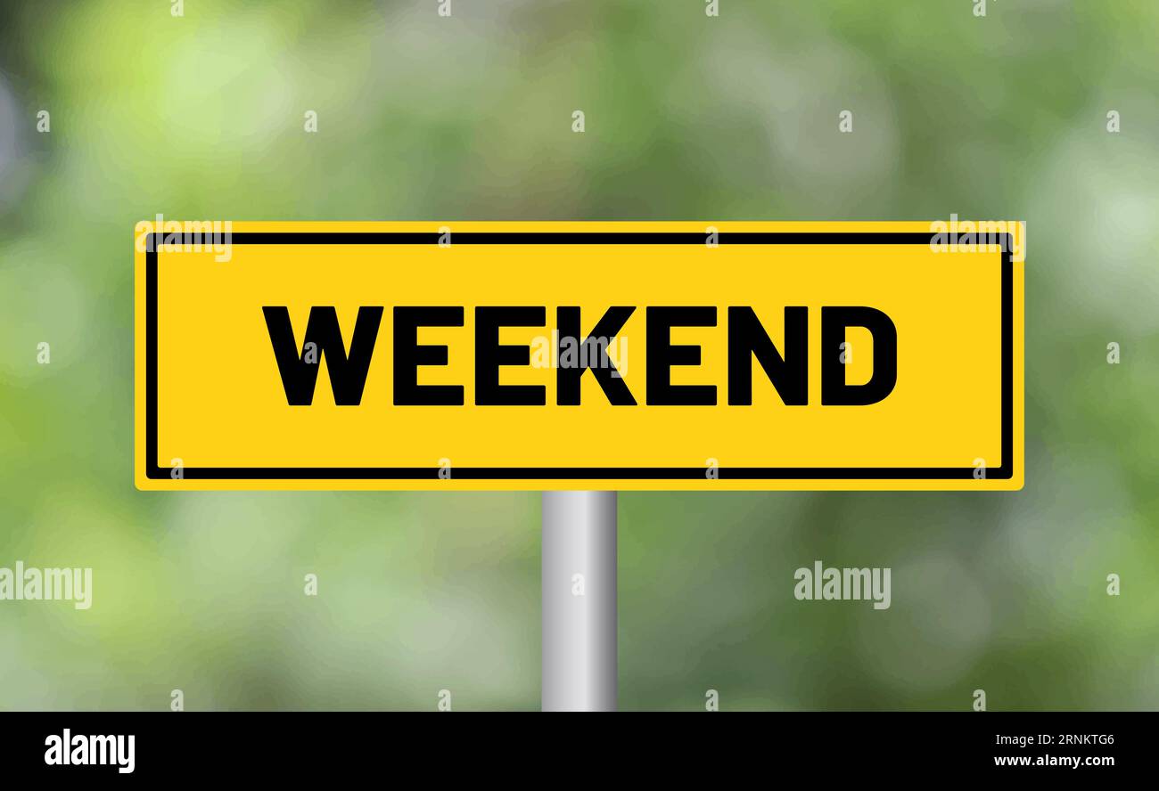 Weekend road sign on blur background Stock Photo - Alamy